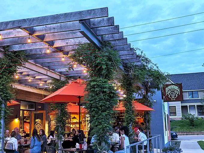 Twilight transforms King Dough's patio into an urban oasis where pizza dreams and string lights intertwine under the Indianapolis sky.
