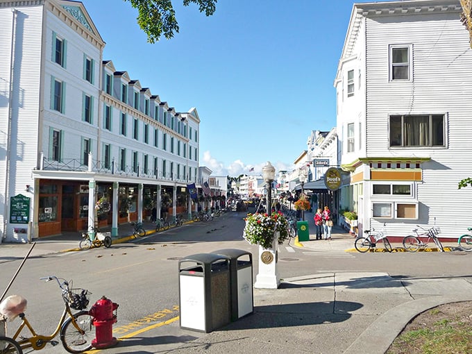 The grand white buildings of Mackinac Island stand like elegant time travelers from another century. Bicycles parked nearby remind you this is Michigan's car-free paradise.