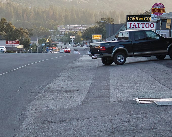 Where donuts meet gold and tattoos! This Oakhurst street corner offers the holy trinity of retirement splurges – sugar fixes, body art, and pawning your ex's jewelry.