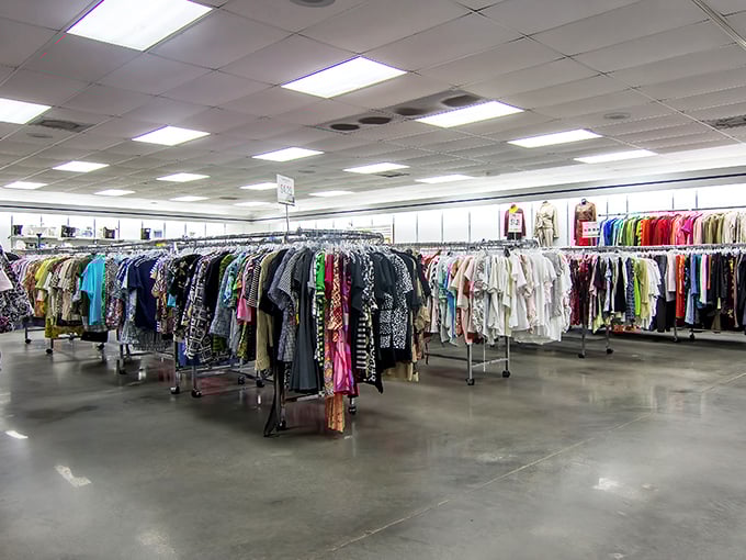 Rows of colorful clothing stretch endlessly like a rainbow of second-hand possibilities waiting to be discovered by savvy shoppers. 