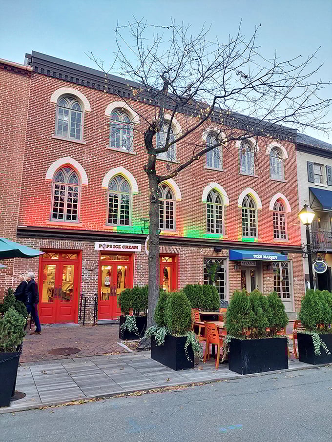 Pop's at twilight—where the rainbow-colored windows and red doors promise sweet dreams for night owls.
