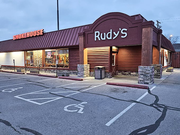 As evening falls, Rudy's Smokehouse glows with promise – where wood-fired dreams come true for barbecue pilgrims.