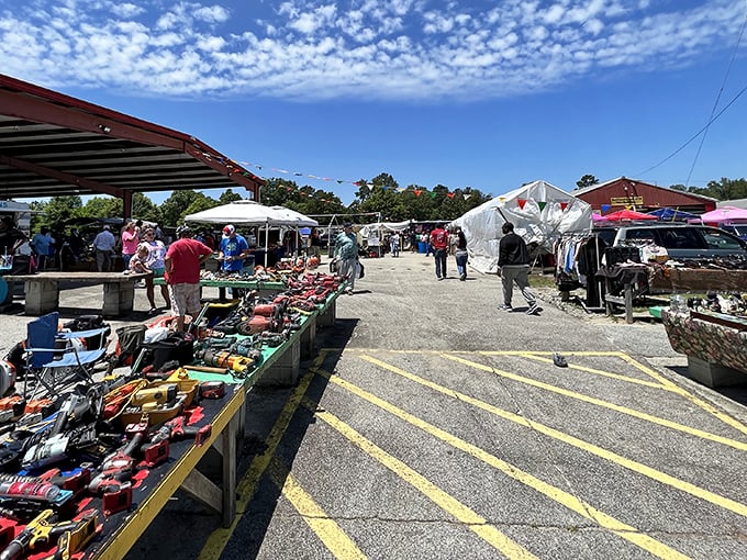 Blue skies and bargains! Smiley's outdoor section buzzes with activity as shoppers browse tables loaded with potential treasures.