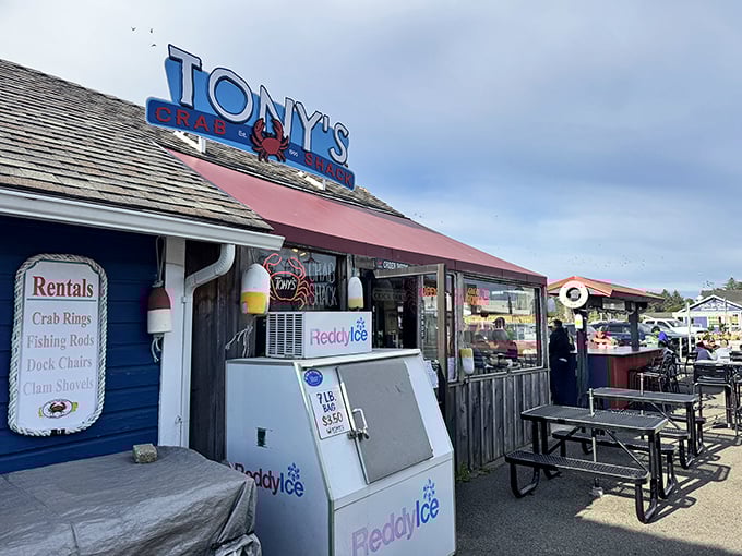 That cheerful red awning promises fresh crab and ocean views – no fancy tablecloths required, just pure coastal goodness.