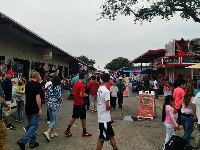 The weekend crowd flows through Traders Village like bargain-hunting pilgrims on their way to the promised land of deals.