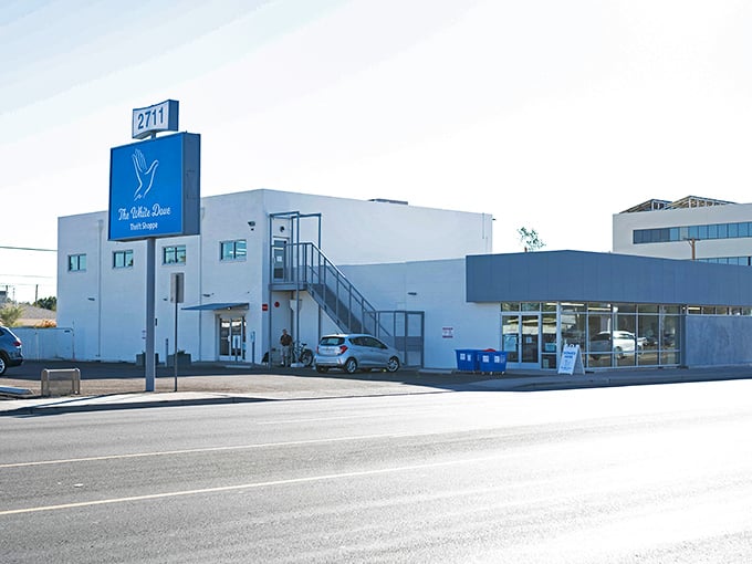 A pristine white building with blue accents—this thrift paradise is where wallet-friendly treasures await discovery.