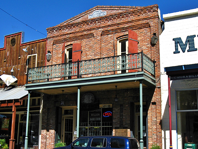 The A. Brosemer Building stands proudly with its ornate ironwork balcony—architectural eye candy from an era when craftsmanship wasn't rushed.