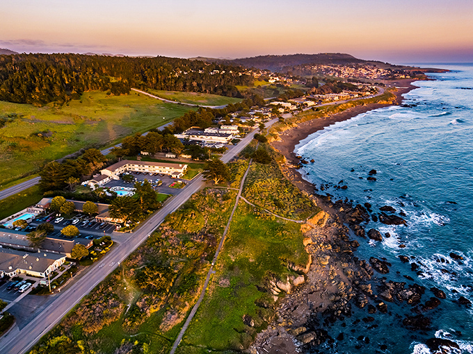 Sunset paints Cambria in golden hues as the Pacific kisses the shoreline. From above, you can almost hear the town whispering, "Slow down, you've arrived."