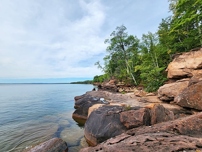 Lake Superior's artistic side on full display. These sandstone cliffs weren't just formed—they were sculpted, like God took a pottery class and really found His groove.