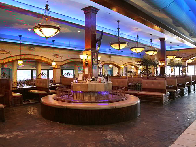 Step inside and you're transported to a maritime wonderland, where elegant chandeliers cast a warm glow over comfortable booths and a stunning central fountain.