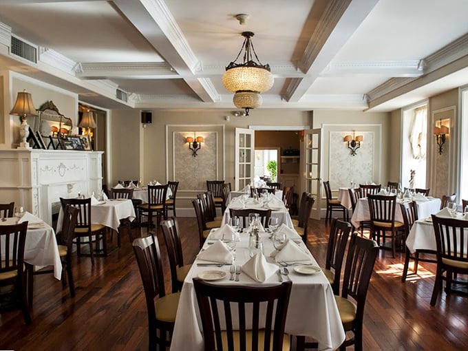 Step inside to a dining room where time stands still – crisp white tablecloths, elegant chandeliers, and the promise of pasta perfection.