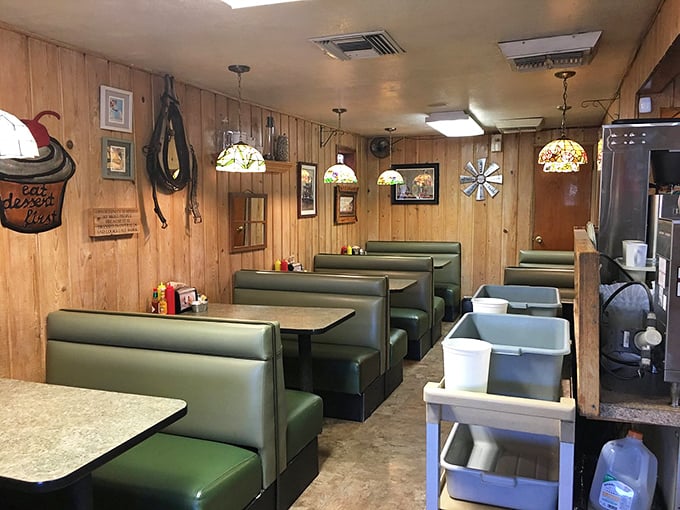 Wood-paneled walls, green vinyl booths, and stained glass pendant lights—this isn't retro by design, it's authentic by survival. Comfort begins before the food arrives.