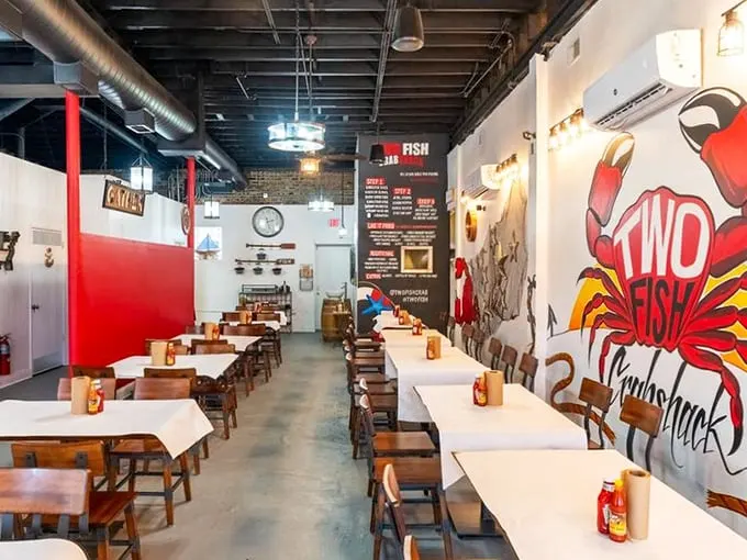 Simple wooden tables covered in white paper stand ready for battle—the delicious kind where everyone wins and napkins are casualties.