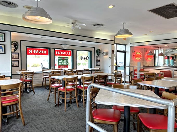 Simple wooden chairs and red vinyl seats create the perfect no-frills backdrop for the culinary star of the show—those legendary cheeseburgers everyone's talking about.