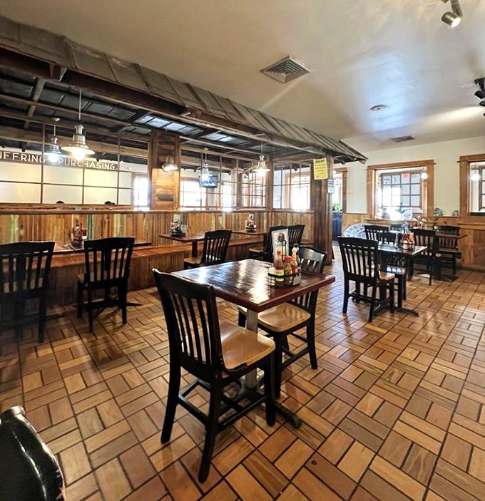 Wooden tables, simple chairs, and tile floors create the perfect backdrop for seafood feasts. No distractions here—just you and those legendary hush puppies.