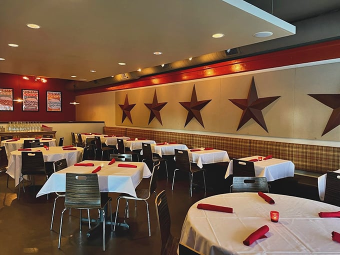 Metal stars adorn the walls while plaid upholstery adds homey charm. It's like dining in your stylish friend's kitchen—if your friend made incredible burgers.
