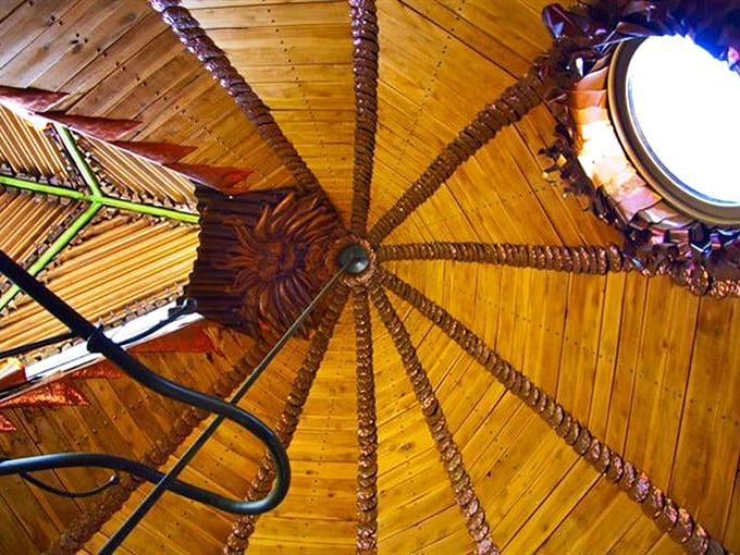 Looking up reveals a wooden mandala that would make any cathedral jealous of its organic geometry.