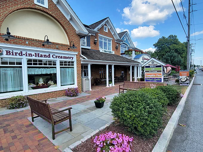 Brick, blooms, and benches welcome visitors to Bird-in-Hand Creamery, where ice cream isn't just dessert—it's practically a constitutional right.