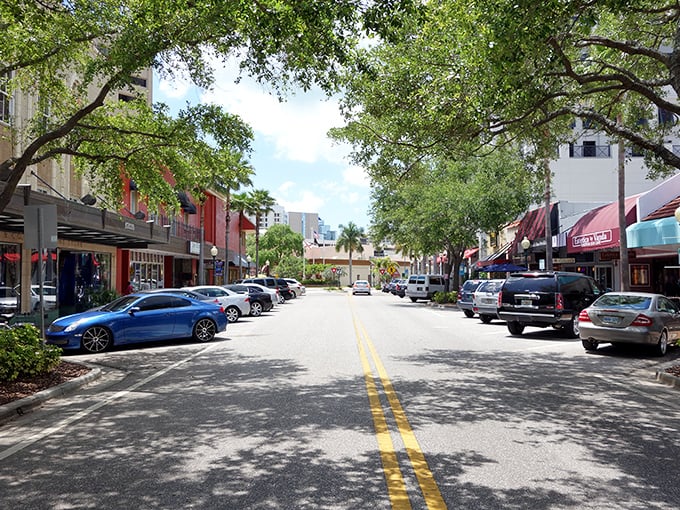 Tree-lined streets and colorful awnings create Sarasota's walkable downtown vibe – like someone designed a city specifically for leisurely afternoon strolls.