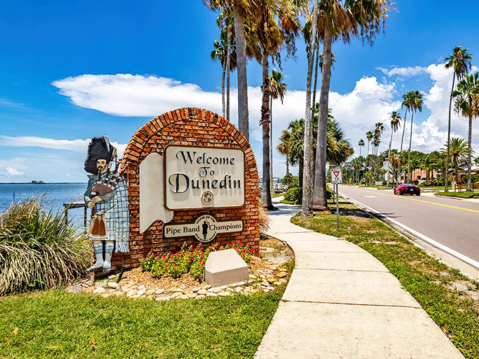 The welcome sign says it all—bagpipes and palm trees, an unlikely marriage that somehow works perfectly in this Scottish-flavored slice of Florida paradise.