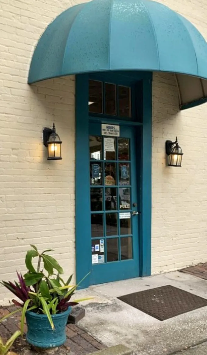That teal door isn't just an entrance—it's a portal to bargain paradise. The lanterns stand guard like sentinels protecting a trove of secondhand treasures.