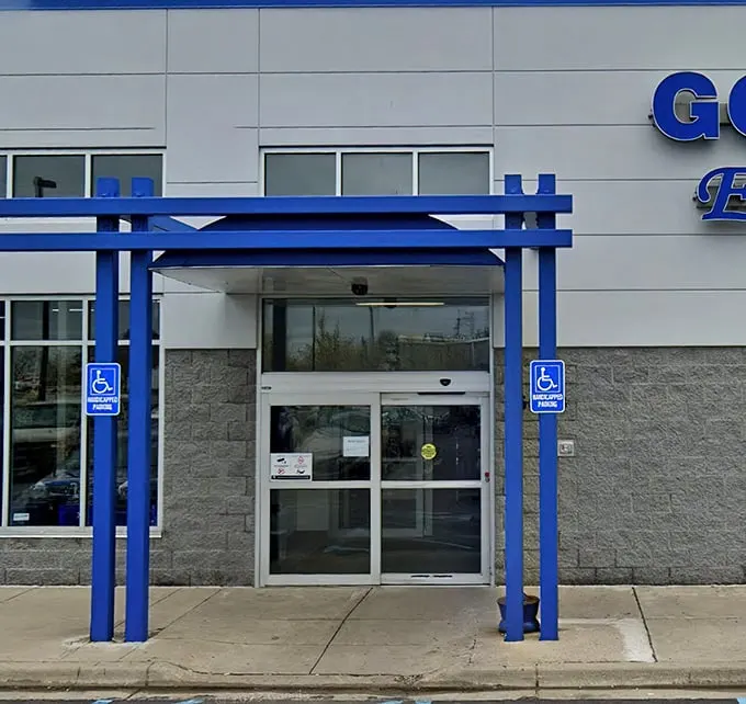 Those iconic blue pillars frame the entrance to bargain paradise—like the pearly gates for the fiscally responsible.