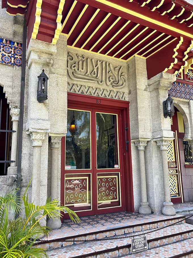 The entrance speaks volumes before you even step inside—Arabic inscriptions, ornate red doors, and geometric patterns promising an architectural adventure unlike anything else in Florida.