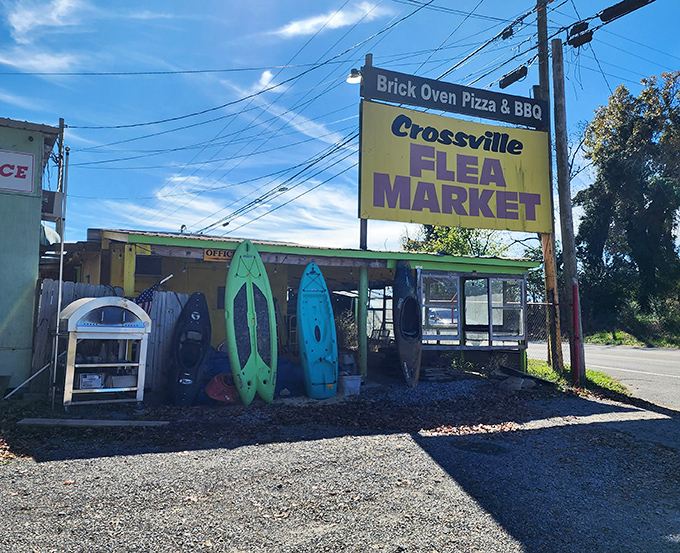 The unassuming entrance belies what lies beyond – kayaks, window frames, and endless possibilities under that bright Tennessee sky.