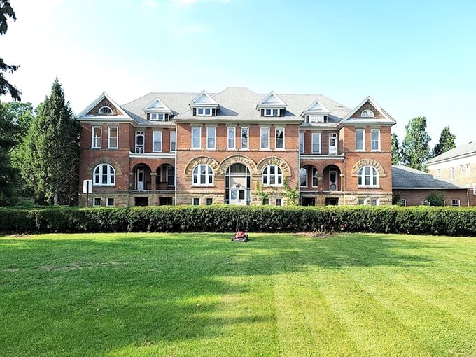 Manicured lawns can't soften the building's stern presence. This architectural time capsule has witnessed nearly two centuries of Ohio history—not all of it pleasant.