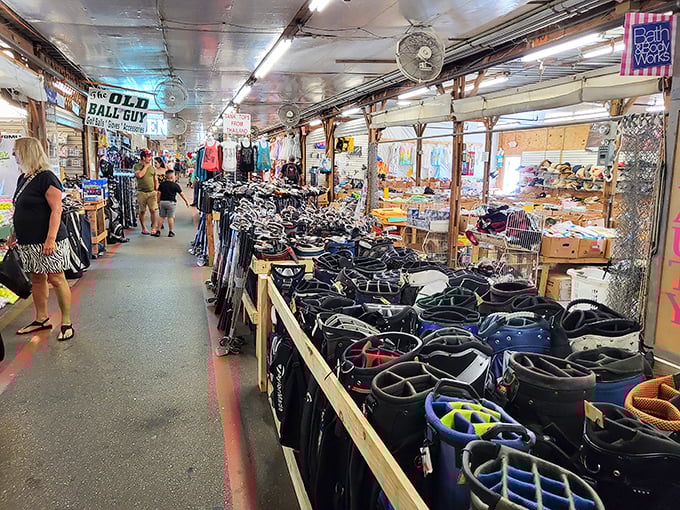 The "Old Ball Guy" knows his game! Rows of golf bags stand at attention, ready for Florida's fairways and your next hole-in-one.