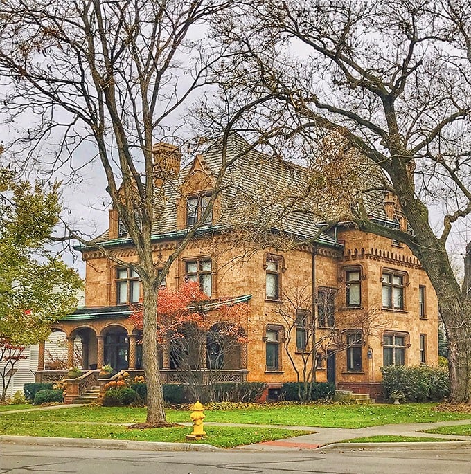 This honey-hued stone mansion isn't just a house—it's architectural swagger from an era when craftsmanship mattered more than square footage.