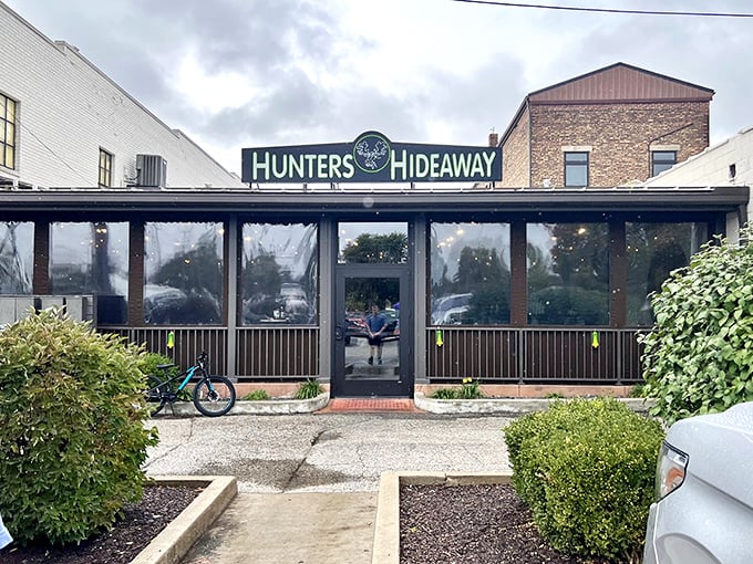 Hunters Hideaway beckons with its cozy enclosed porch—the kind of unpretentious local spot where regulars have their own mugs and newcomers become friends.