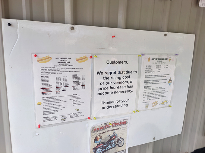 The humble menu board tells a familiar small business story – honest food at fair prices, with a touch of economic reality that somehow makes you love the place even more.