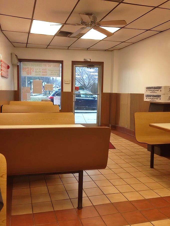 No-frills dining at its finest. These wooden booths have witnessed countless "first bite" moments of pizza perfection.