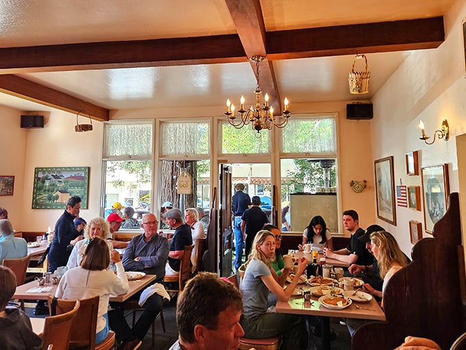 Inside, wooden beams and chandeliers create the perfect backdrop for breakfast drama – where the only conflict is deciding between benedicts and that famous French toast.