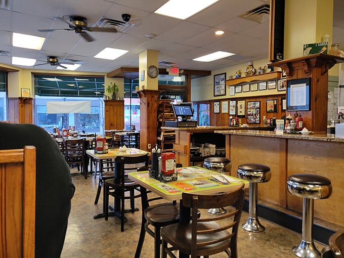 Classic diner charm with wood paneling and chrome stools – where breakfast dreams come true and calories don't count until tomorrow.