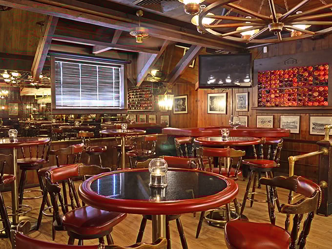Step inside and time slows down. Rich wood paneling, wagon wheel chandeliers, and those signature red-trimmed tables create the steakhouse atmosphere of your dreams.