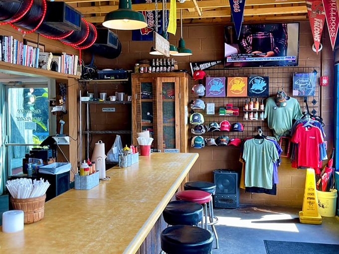 Inside, college pennants and barbecue memorabilia create a shrine to smoked meat devotion. This isn't decoration—it's a barbecue hall of fame. 