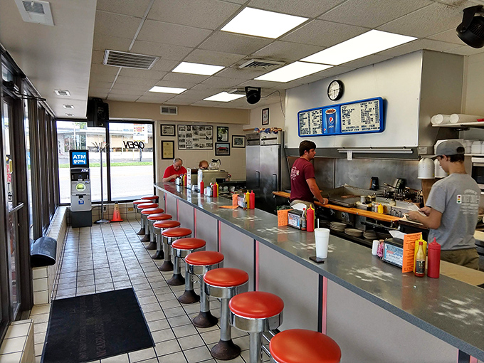 Classic Americana at its finest – those cherry-red counter stools have witnessed decades of local gossip, first dates, and countless "mmms" over legendary chili.