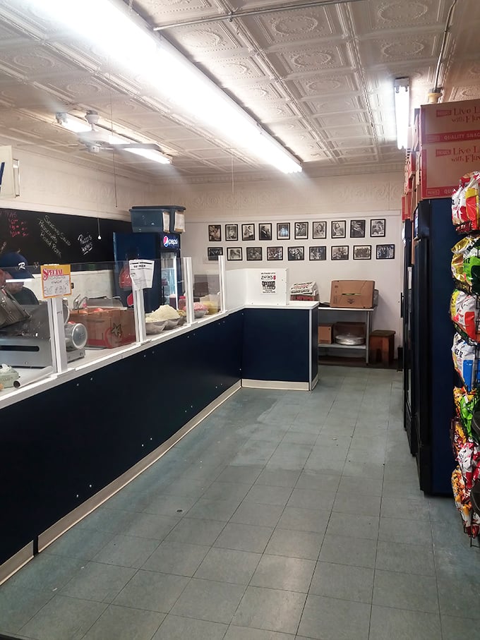Inside, time stands still – pressed tin ceiling, no-nonsense counter, and black-and-white photos that tell stories of Philly's sandwich past.