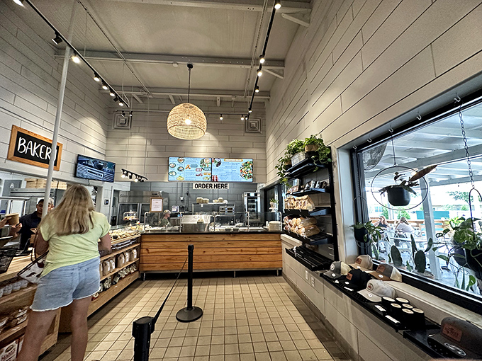 Clean lines, warm wood, and that pendant light that says, "Yes, we're serious about both aesthetics and pastries."