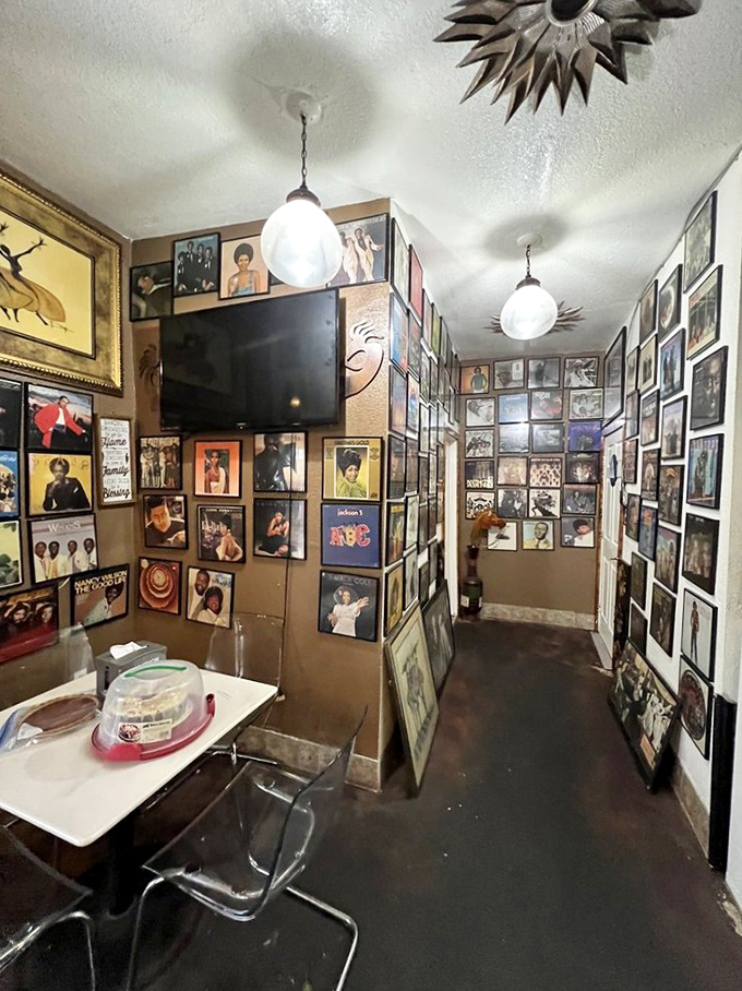 Album covers line every inch of wall space, creating a museum of music history where the soundtrack is the satisfied hum of happy diners. 