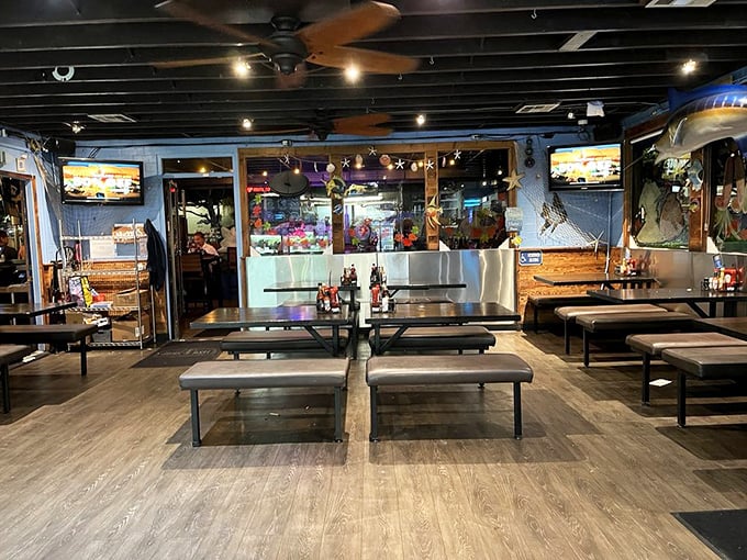 Simple bench seating and nautical vibes create the perfect backdrop for seafood feasting—no white tablecloths needed when the fish is this fresh.