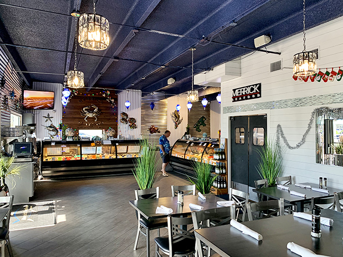 Where seafood market meets restaurant magic – the interior's nautical blues and wooden accents set the perfect stage for oceanic delights.