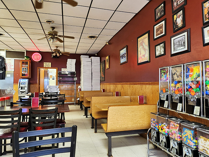 No fancy frills needed here—just wooden booths, ceiling fans, and enough pizza boxes stacked to build a small fort. This is comfort defined.