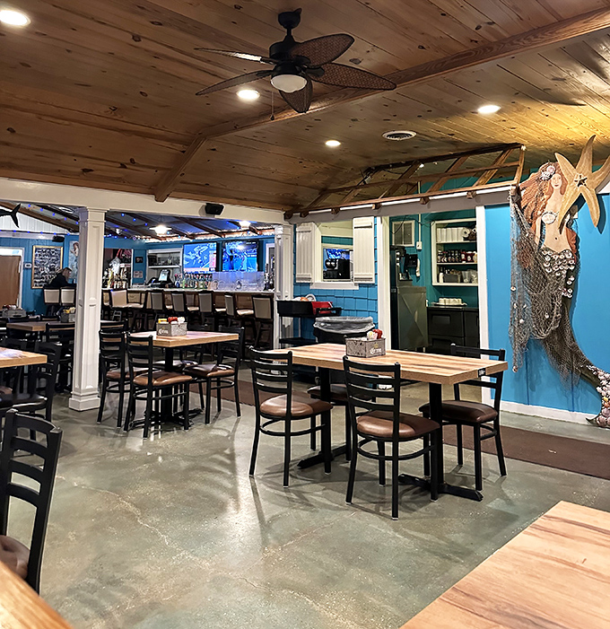 Wooden ceiling beams, nautical touches, and that mermaid on the wall—The Jetty's interior feels like a seafood lover's dream clubhouse.