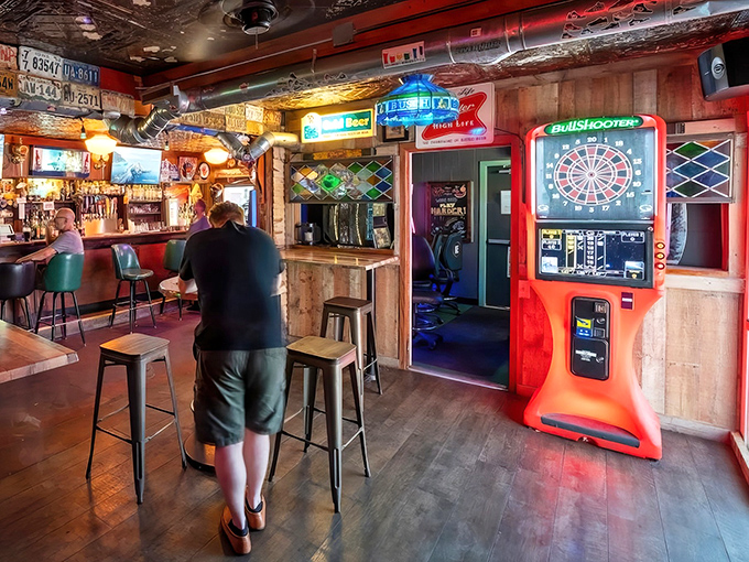 Step inside and the pressed tin ceiling, neon signs, and electronic dartboard tell you everything: this is a place that values substance over Instagram aesthetics.
