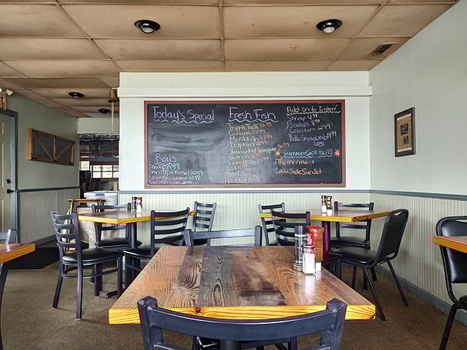 Simple wooden tables and a chalkboard menu set the stage for culinary magic—no white tablecloths required when the seafood does the talking. 