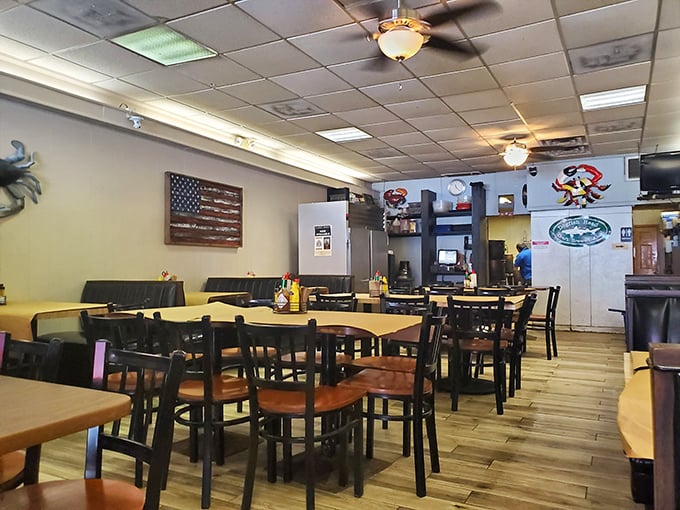 Simple tables, American flag pride, and crab decorations tell you everything you need to know—you're here for serious eating, not interior design awards.