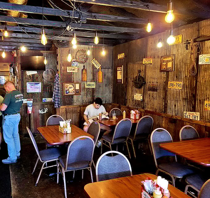 Edison bulbs and license plates create the perfect ambiance for serious meat consumption. This isn't interior design—it's barbecue atmosphere engineering at its finest.